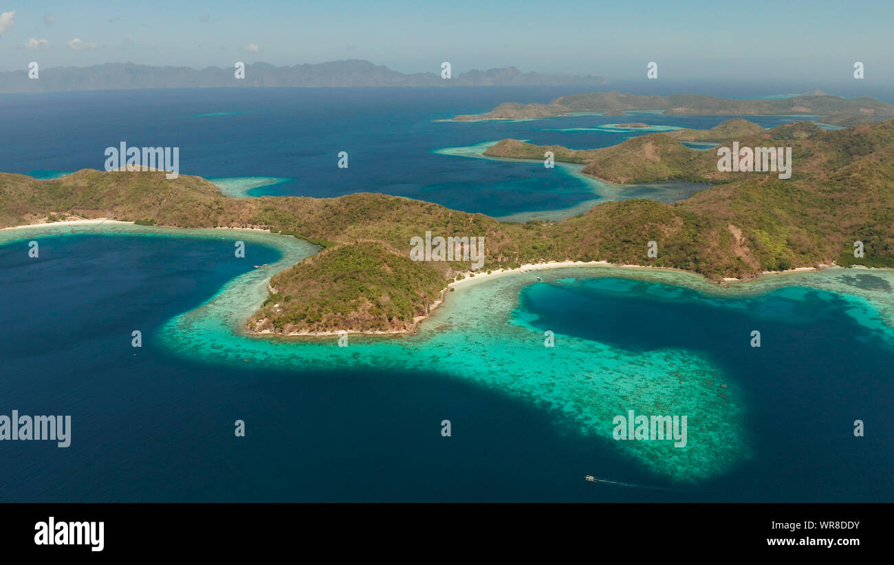 aerial view tropical islands with blue lagoon, coral reef and sandy ...