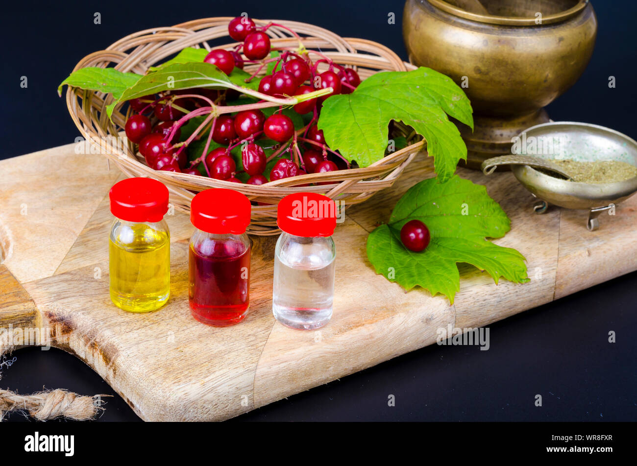 Natural oils, tinctures from fresh berries. Photo Stock Photo - Alamy