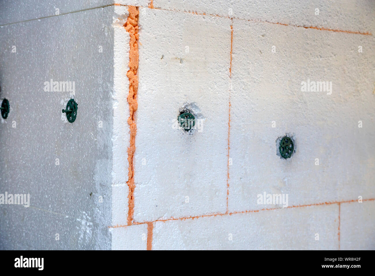 Insulation work of house walls with styrofoam sheets Stock Photo - Alamy