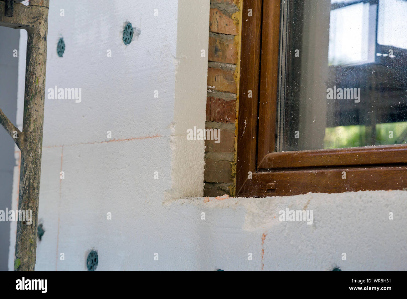 Insulation work of house walls with styrofoam sheets Stock Photo - Alamy