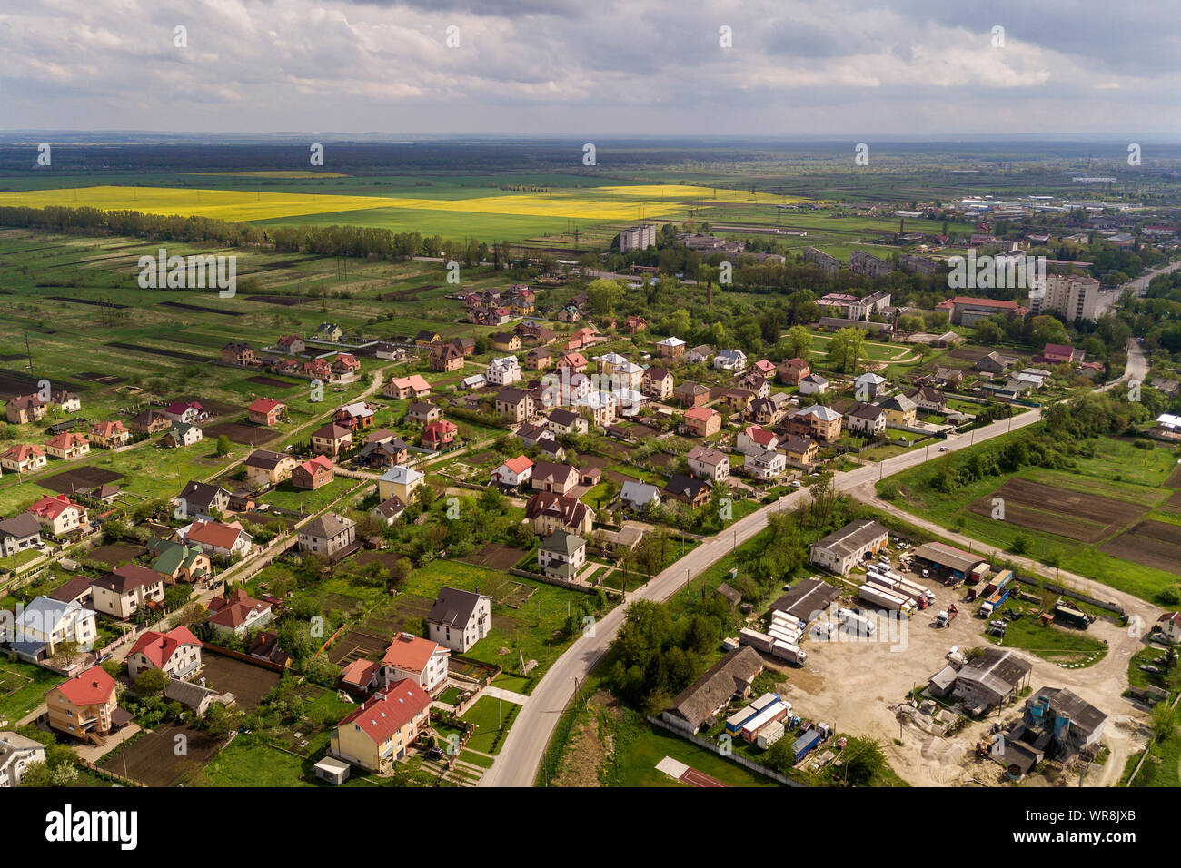 Aerial landscape of small town or village with rows of residential ...