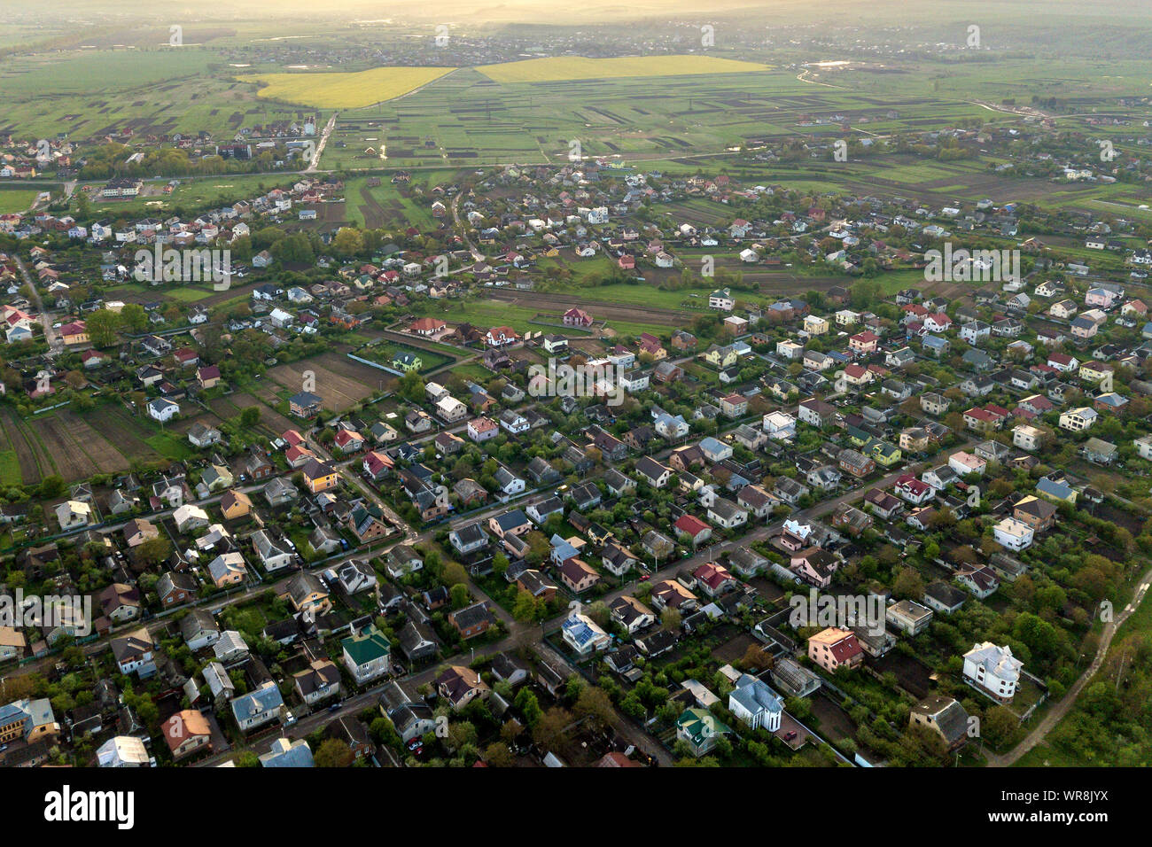 Aerial landscape of small town or village with rows of residential ...