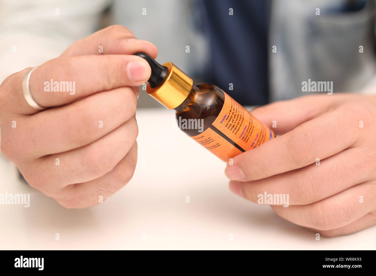 Picture of man drop medicine bottle holding in hand. Isolated on white ...