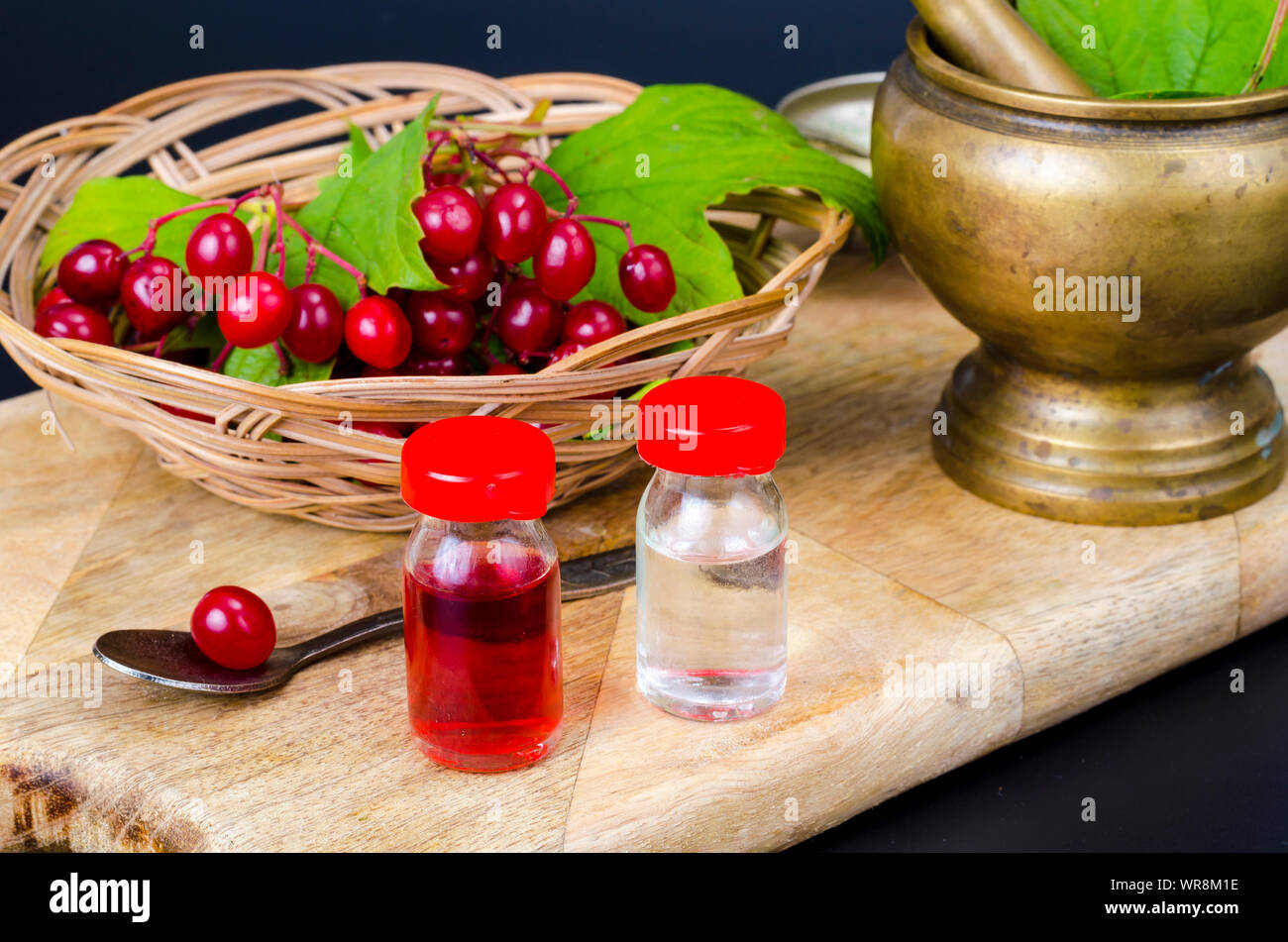 Natural oils, tinctures from fresh berries. Photo Stock Photo - Alamy