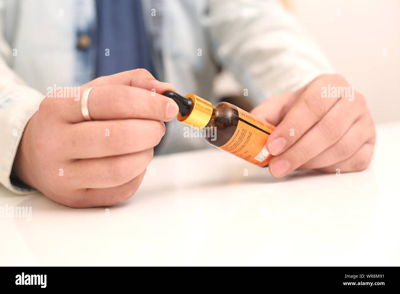 Picture of man drop medicine bottle holding in hand. Isolated on white ...