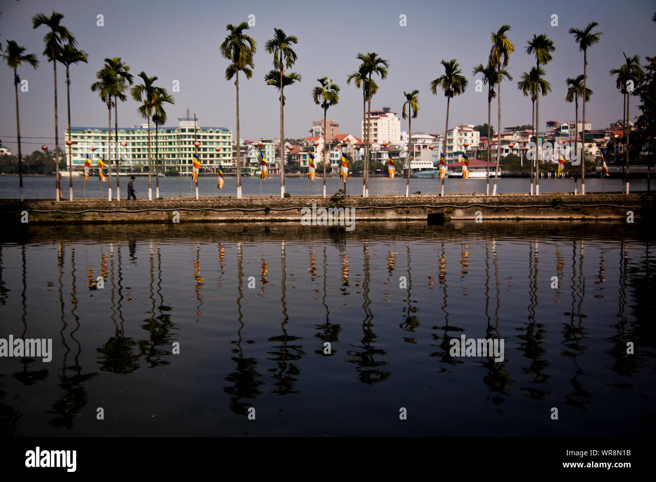 Palm trees line the path leading to Chua Tran Quoc, a temple on West ...