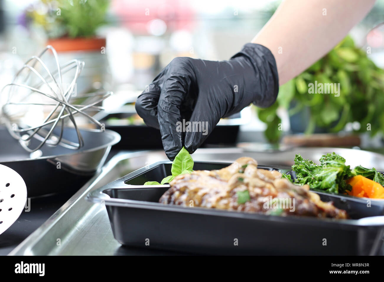 Catering. Meal prep.The cook prepares take-out dishes Stock Photo - Alamy