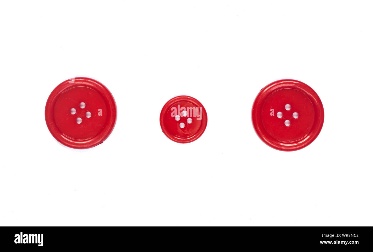 Three Various red sewing buttons isolated on background Stock Photo - Alamy