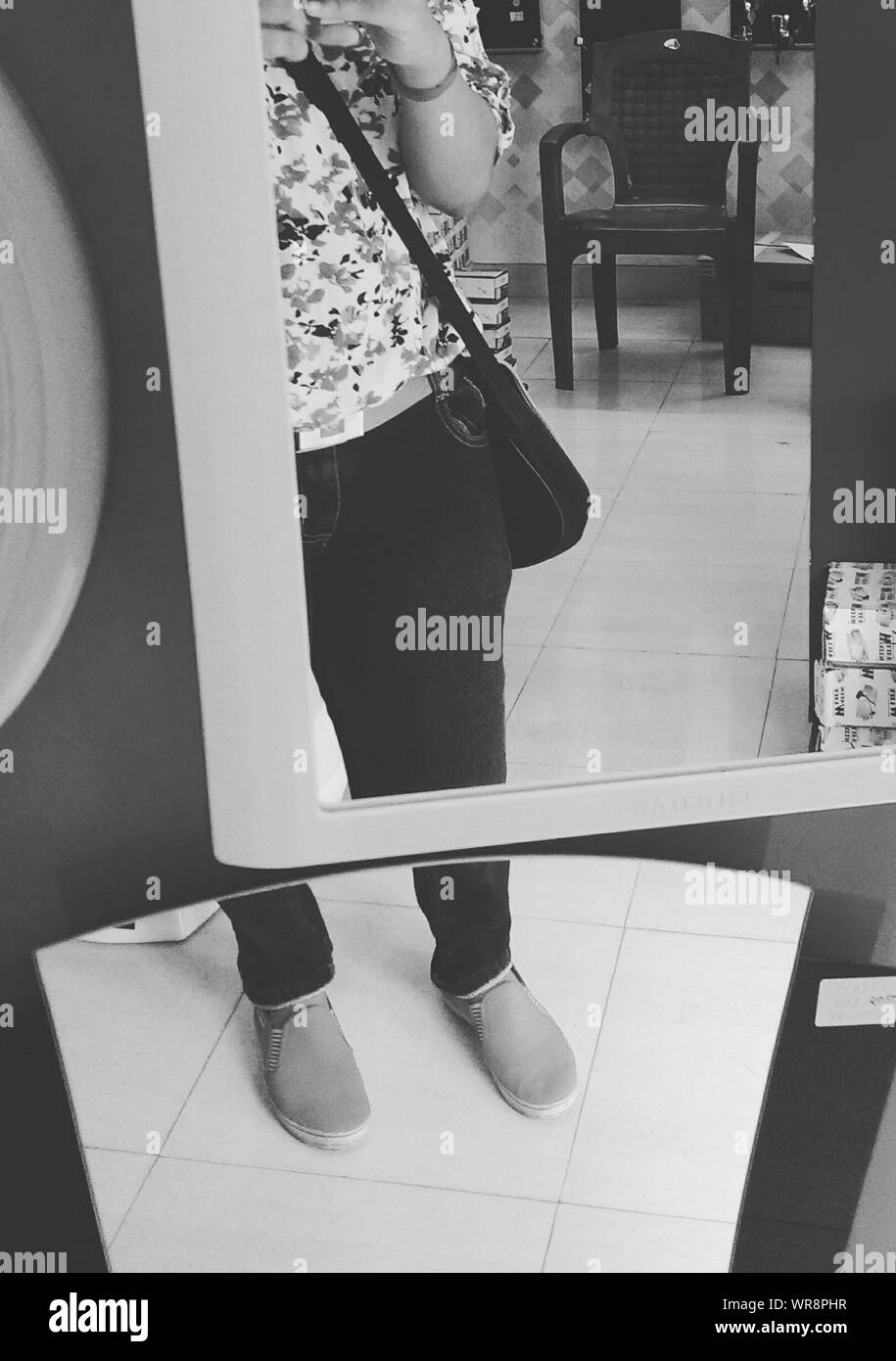 Woman standing leg on chair hi-res stock photography and images - Alamy