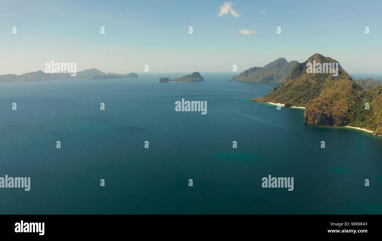aerial view blue sea and tropical islands with beaches and mountains ...