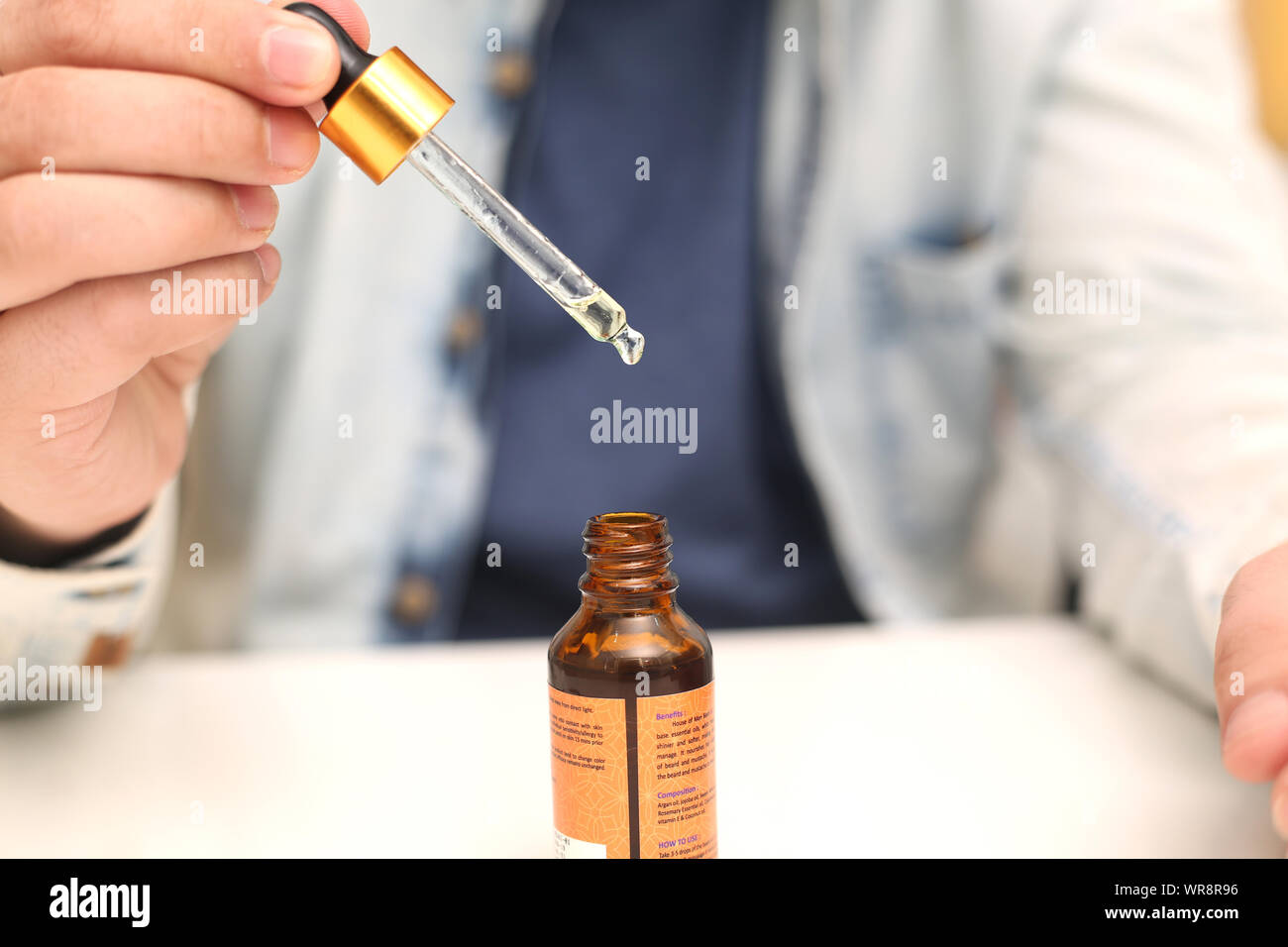Picture of man drop medicine bottle holding in hand. Isolated on white ...