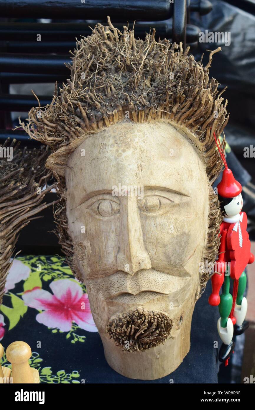 Man face carving on a bamboo shoot Stock Photo - Alamy