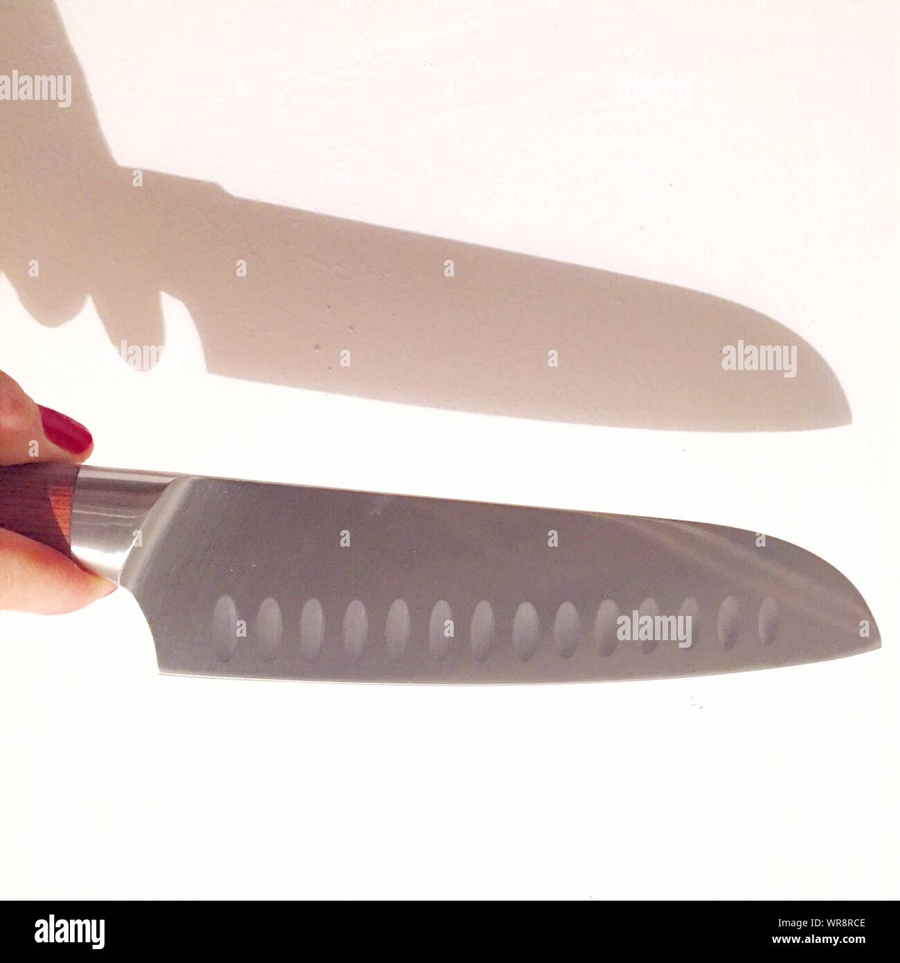 Person with knife shadow hi-res stock photography and images - Alamy