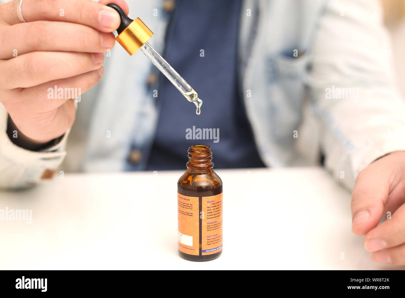 Picture of man drop medicine bottle holding in hand. Isolated on white ...