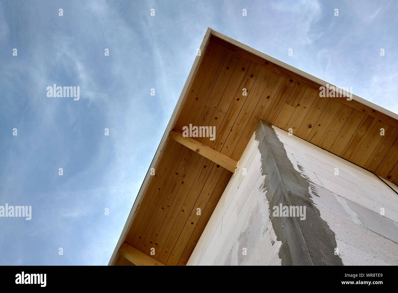 Low angle view of a building fasade under construction unfinished wall ...