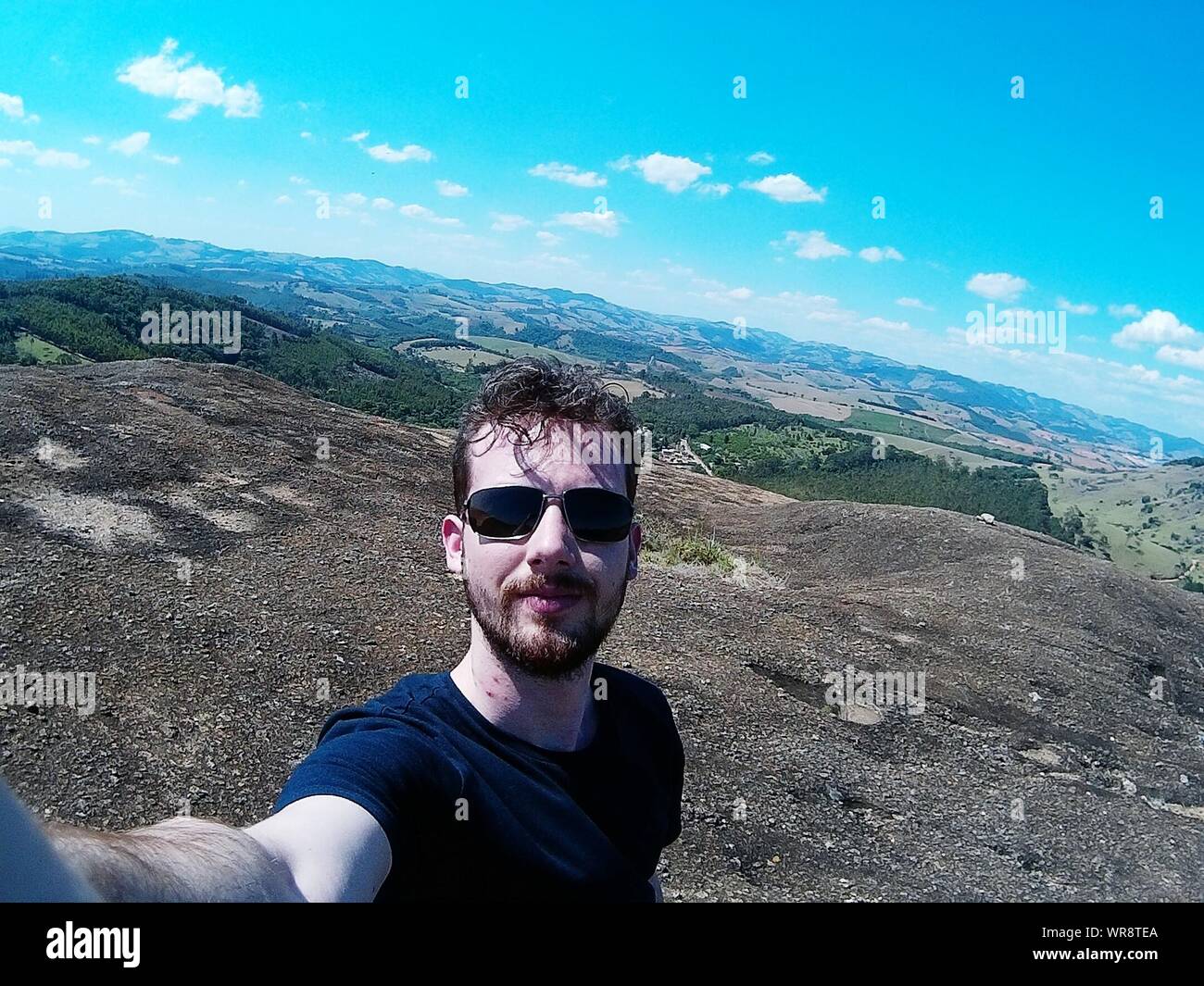 Man Standing In Front Cliff High Resolution Stock Photography and ...