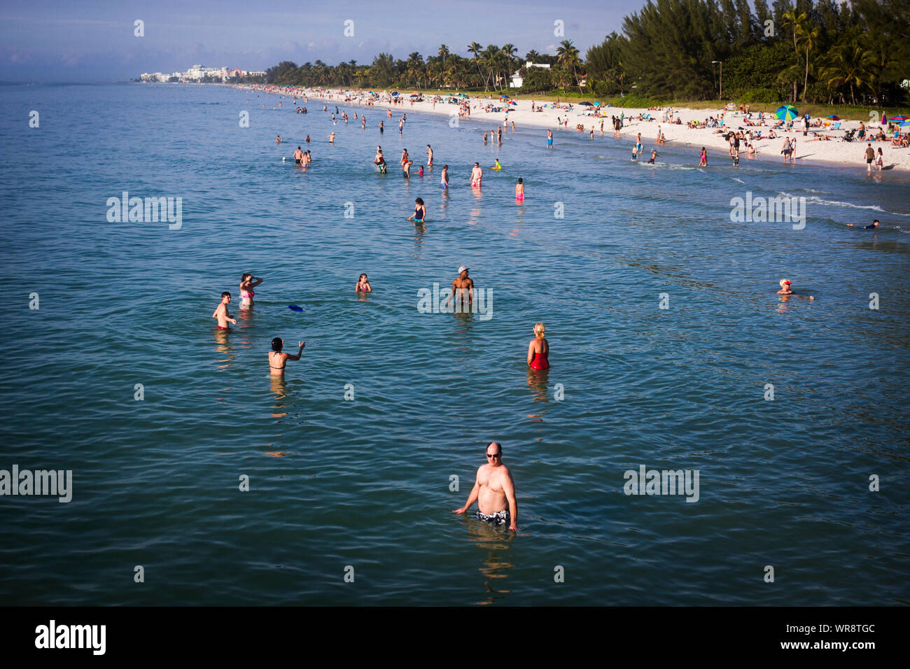 People enjoying the seaside in Naples, Florida, USA Stock Photo - Alamy