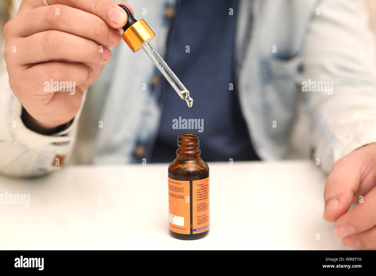 Picture of man drop medicine bottle holding in hand. Isolated on white ...