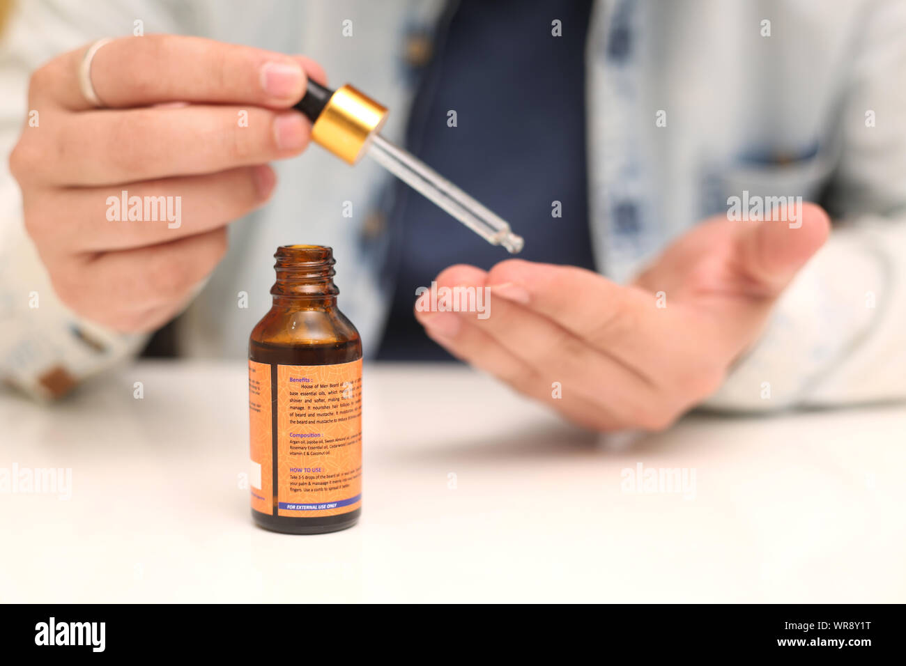 Picture of man drop medicine bottle holding in hand. Isolated on white ...