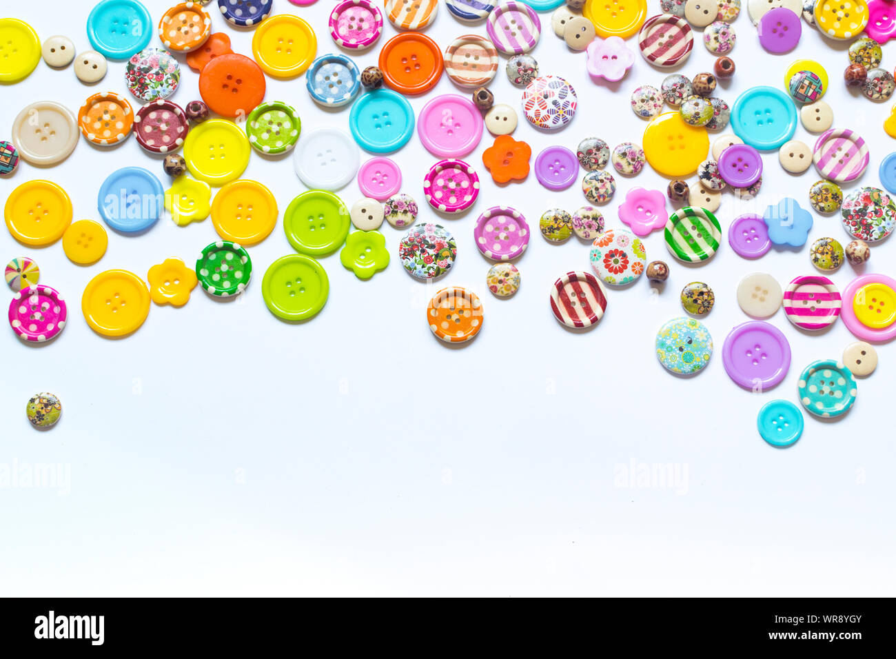 .Various sewing buttons isolated on white background Stock Photo - Alamy