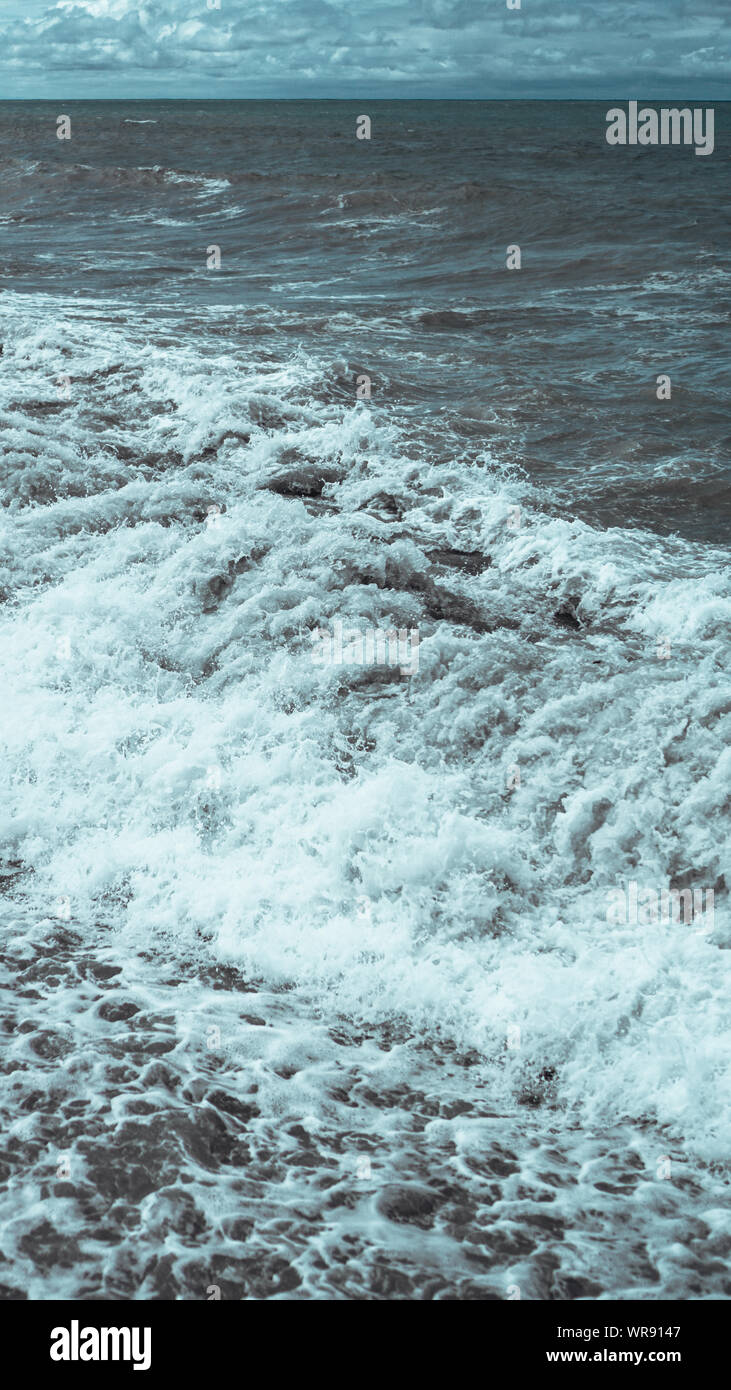 A breaking wave and stormy sea in a vertical panorama format Stock ...