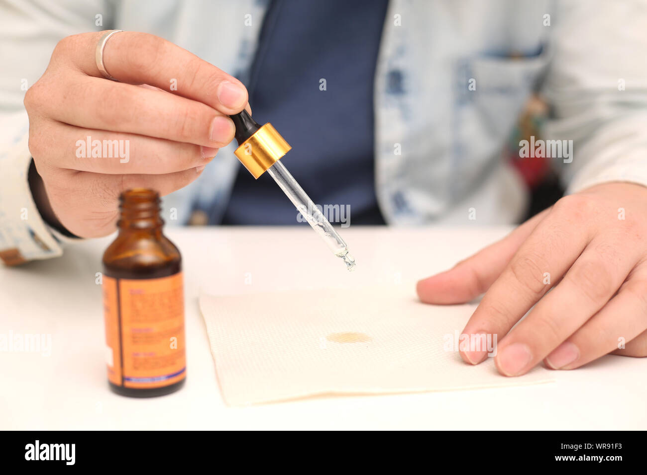 Picture of man drop medicine bottle holding in hand. Isolated on white ...