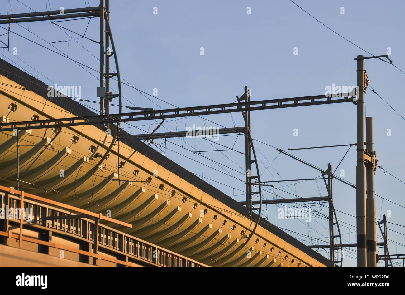 Detail of a modern train station with many interlaced electric cables ...