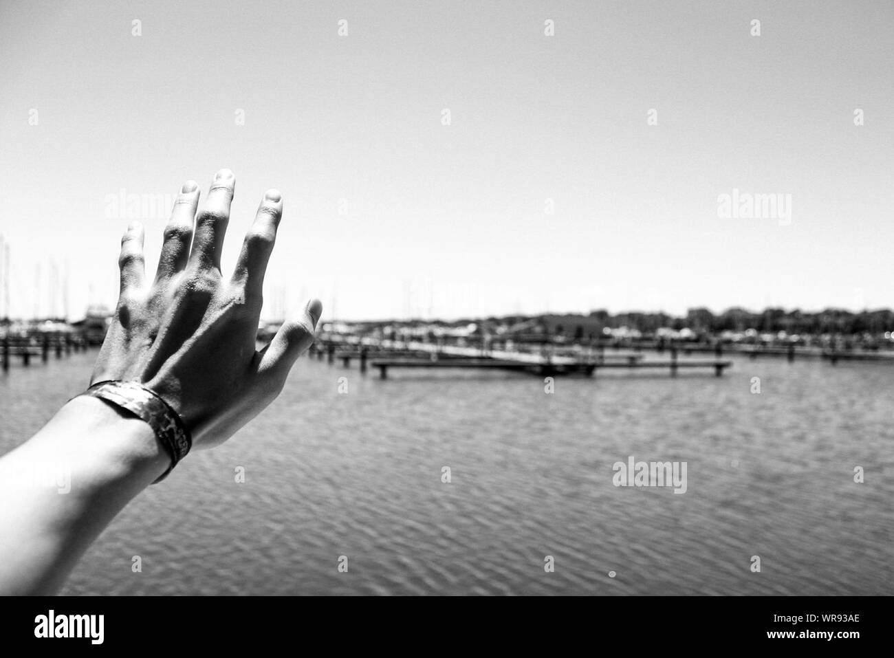 Hand reaching to sky Black and White Stock Photos & Images - Alamy