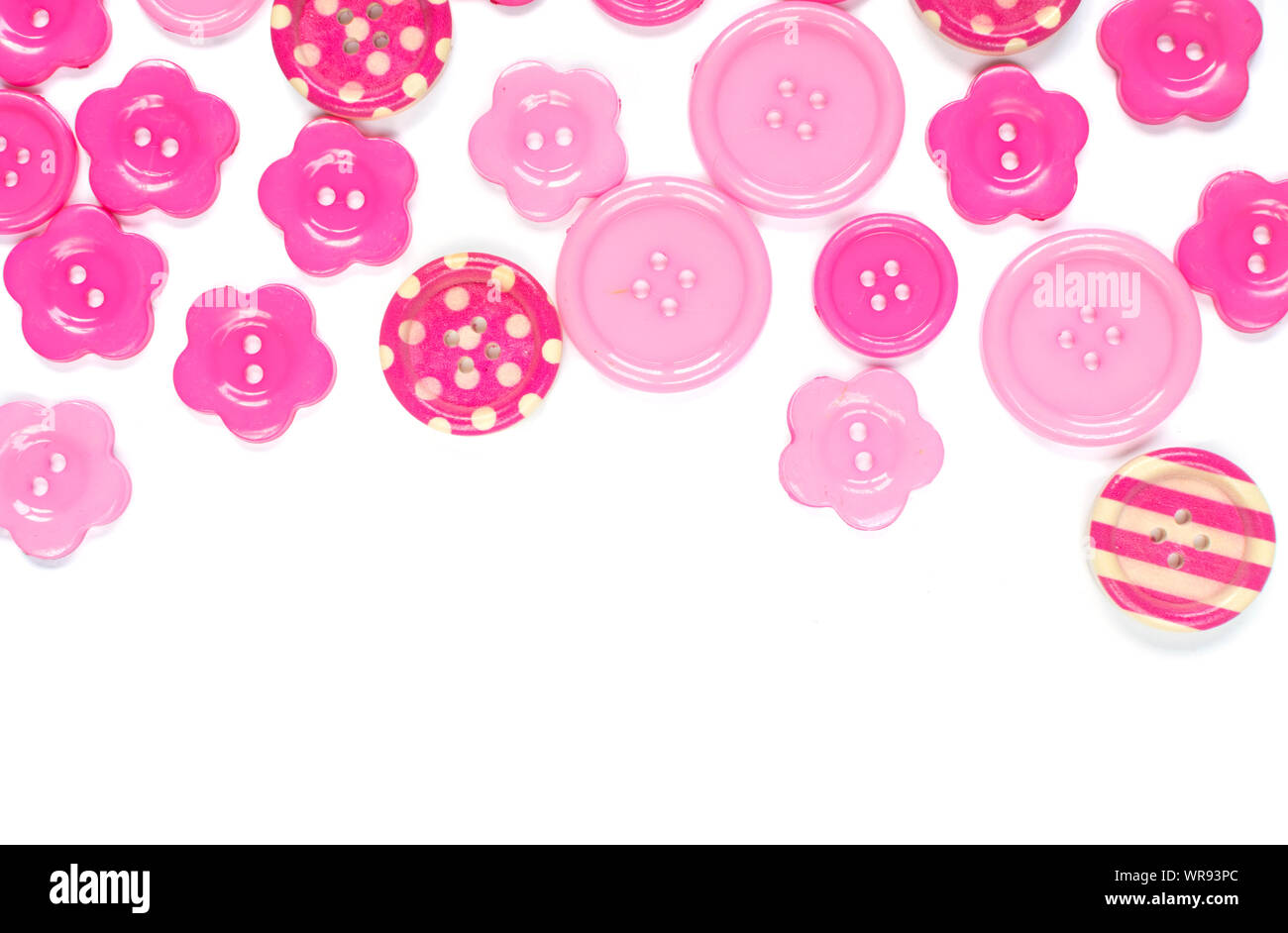 .Various pink sewing buttons isolated on white background Stock Photo ...