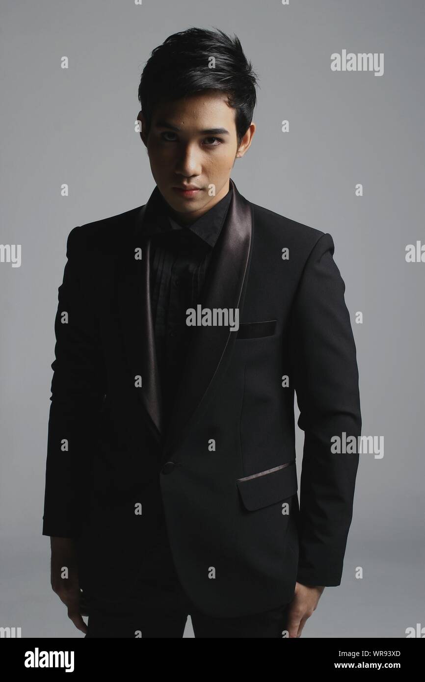 Male model in black suit hi-res stock photography and images - Alamy