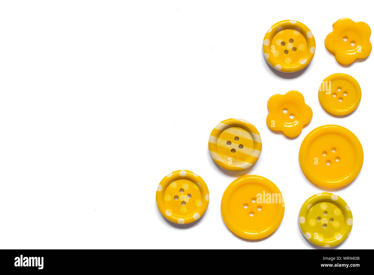 Various yellow sewing buttons isolated on white background Stock Photo ...