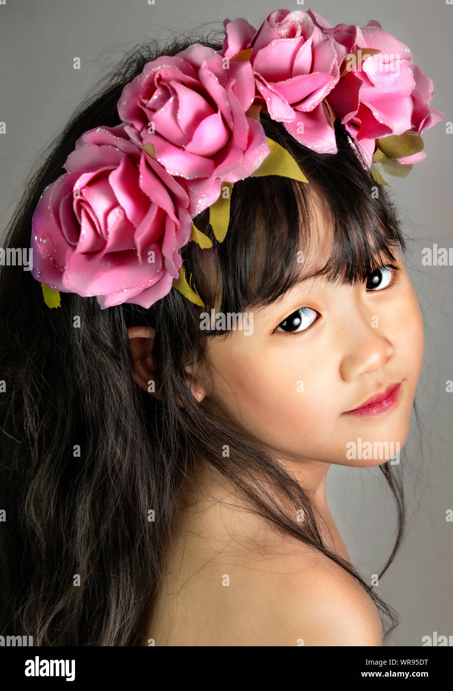 Cute asian little girl with wreath of flowers on her head Stock Photo ...