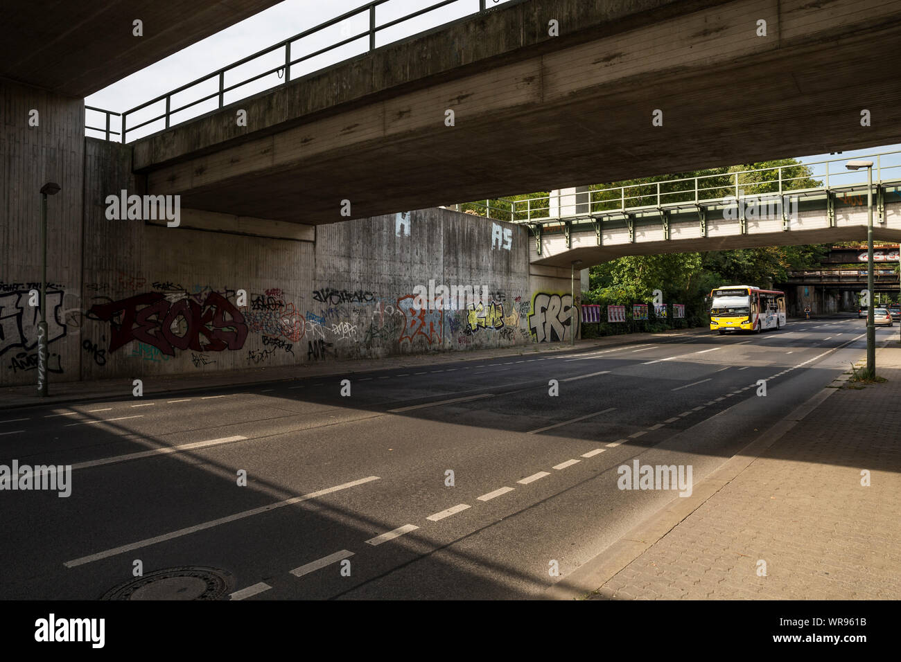 A bus passes under bridges on Priesterweg in Berlin, Germany Stock ...
