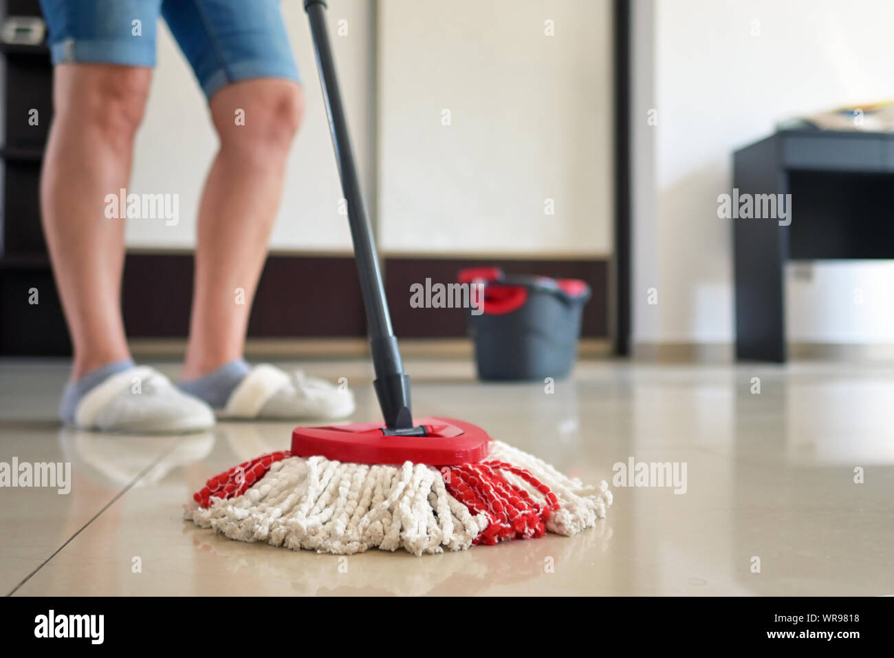 Woman Cleaning Floor with Mop Stock Photo - Alamy
