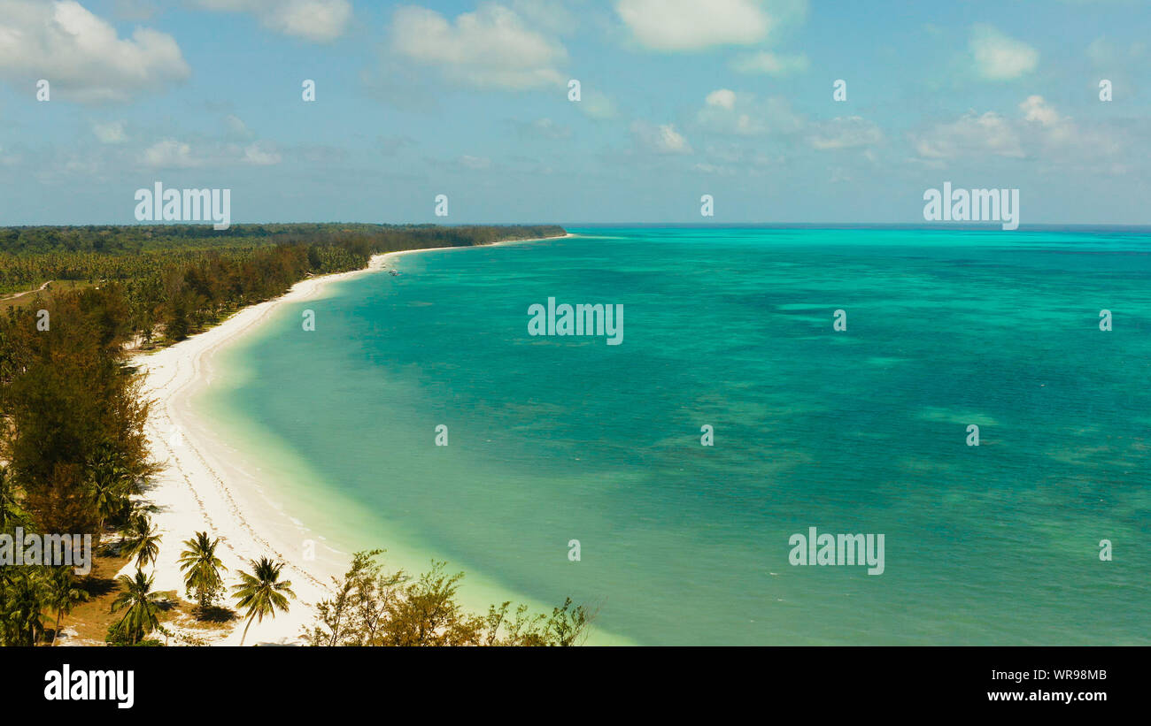 Coast of a tropical island with a sandy beach and turquoise water, top ...