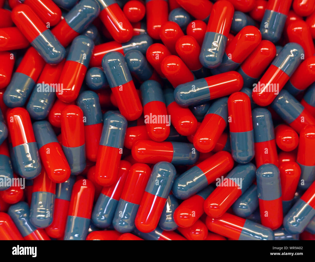 Red and blue capsules hi-res stock photography and images - Alamy