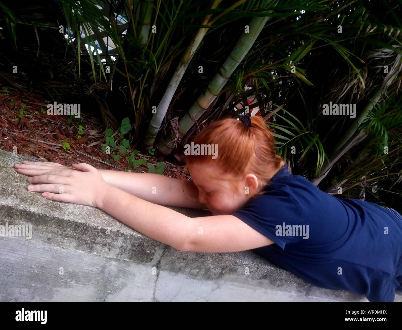 Girl Lying Wall High Resolution Stock Photography and Images - Alamy