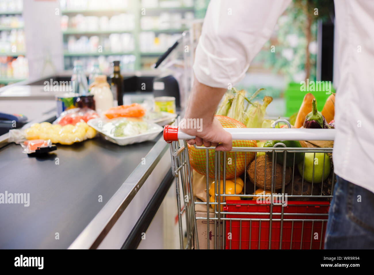 Man buying food products in the supermarket shopping Stock Photo - Alamy