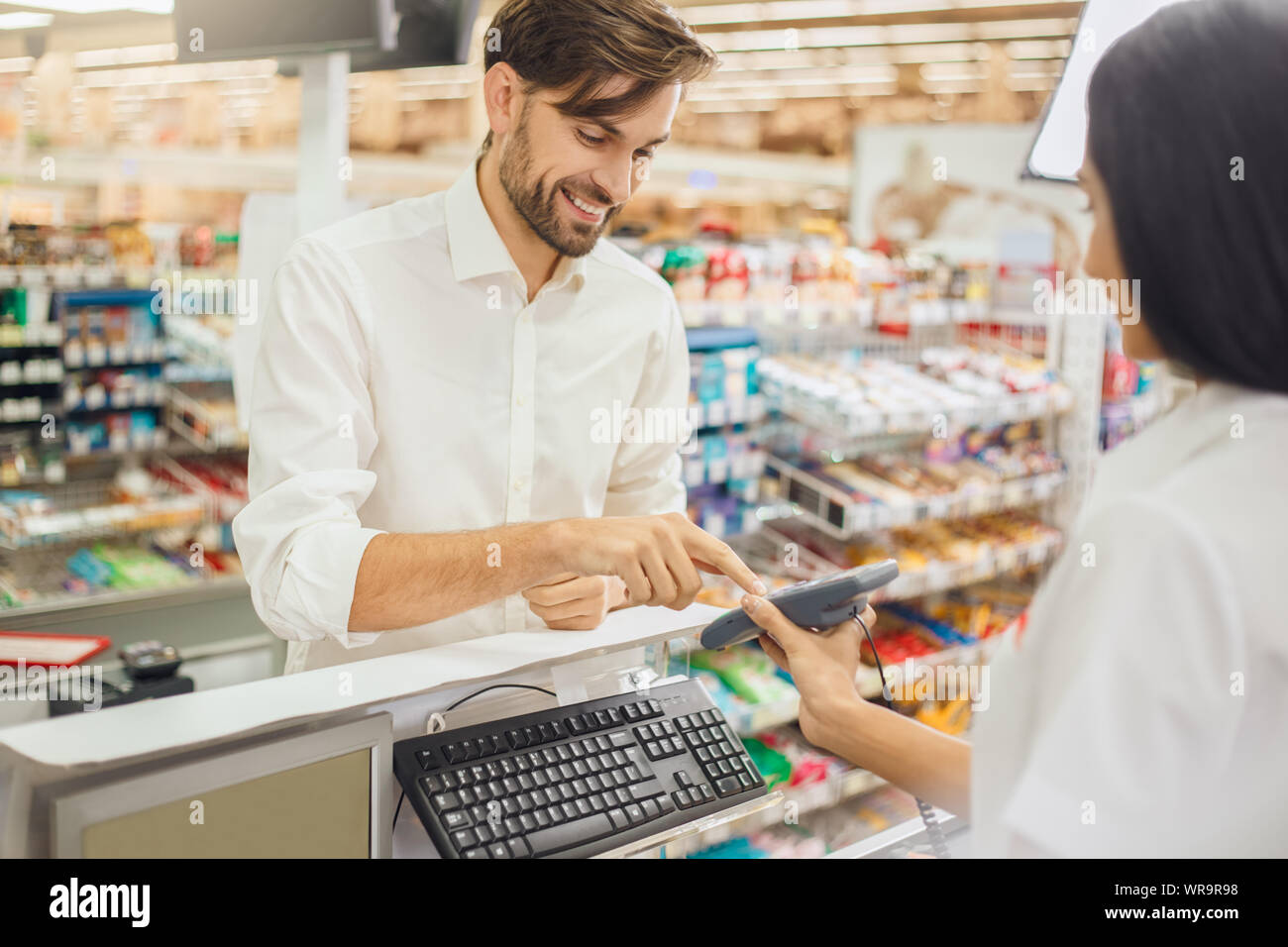 Man buying food products in the supermarket shopping Stock Photo - Alamy