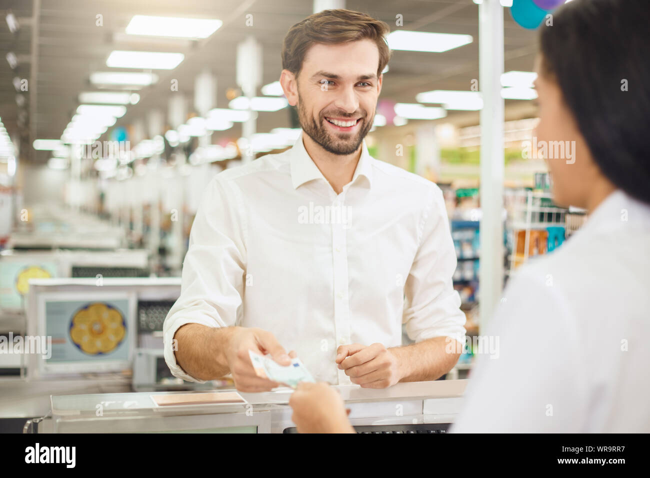 Man buying food products in the supermarket shopping Stock Photo - Alamy