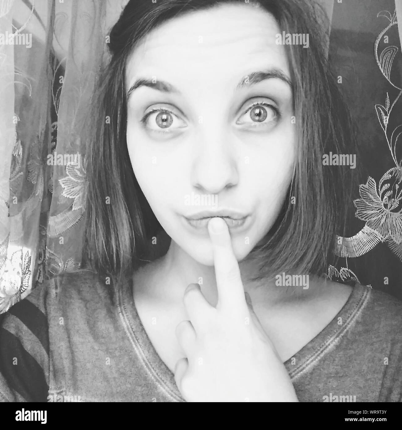 Finger on lips hi-res stock photography and images - Alamy