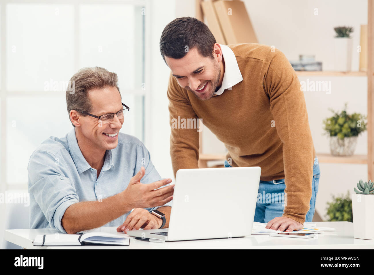 Two business men together in the office Stock Photo - Alamy