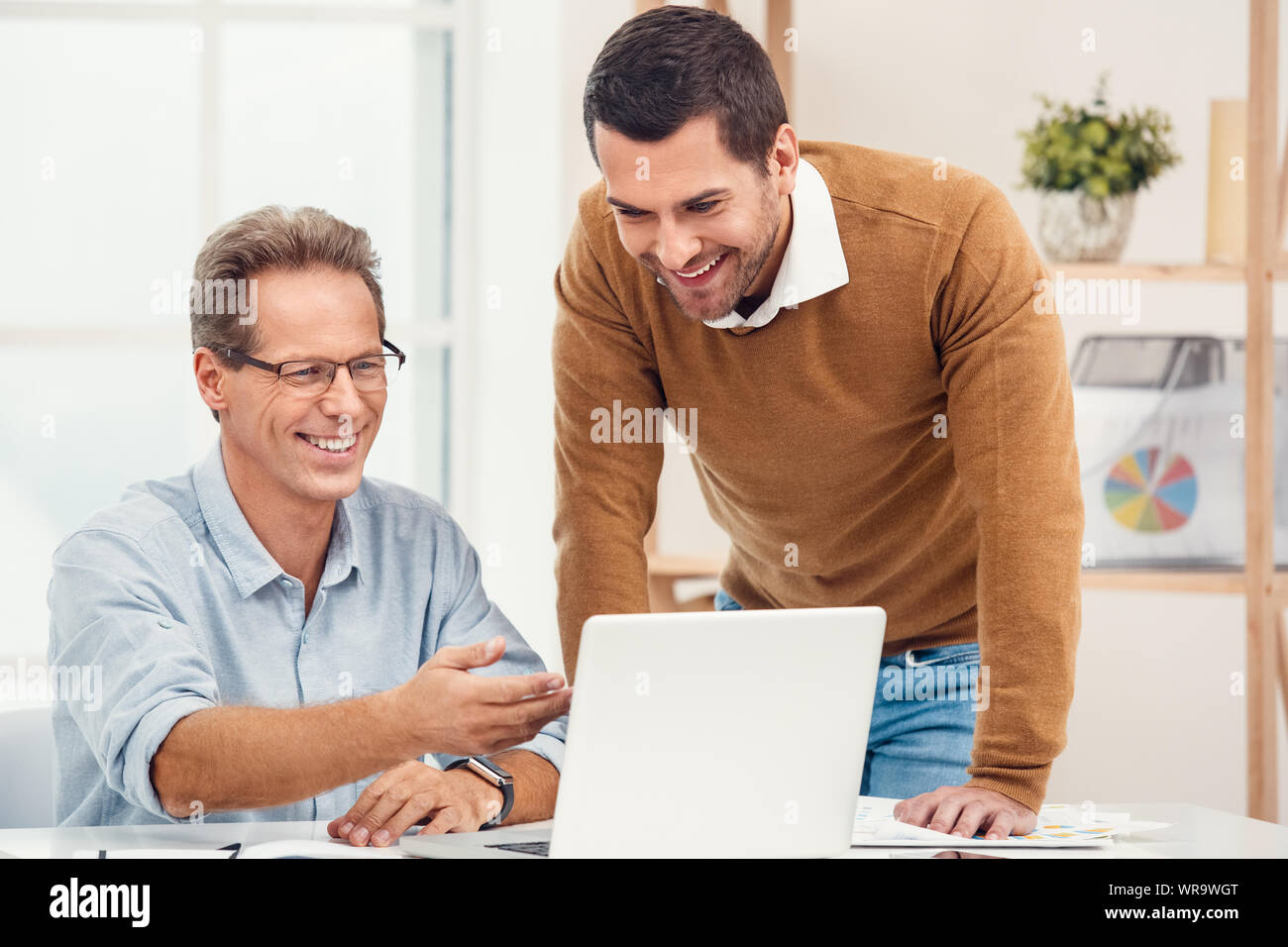 Two business men together in the office Stock Photo - Alamy