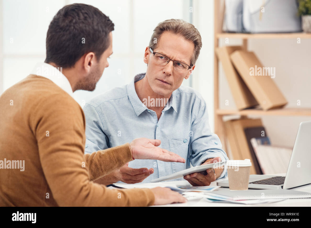 Two business men together in the office Stock Photo - Alamy