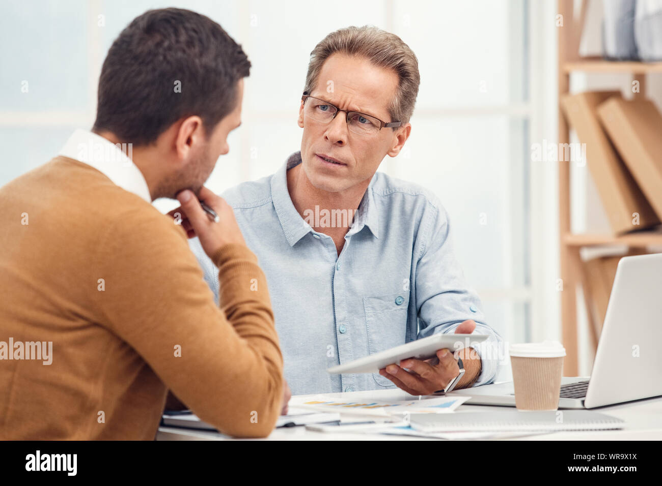 Two business men together in the office Stock Photo - Alamy