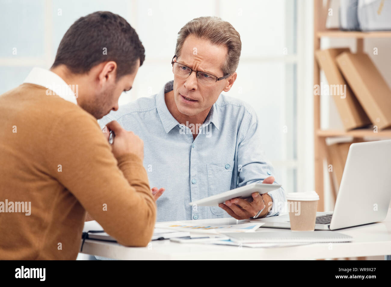 Two business men together in the office Stock Photo - Alamy