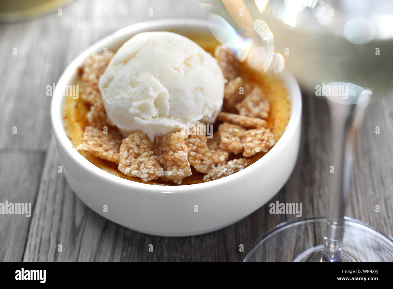 Dessert of cream brulee with ice cream and sesame in caramel Stock ...