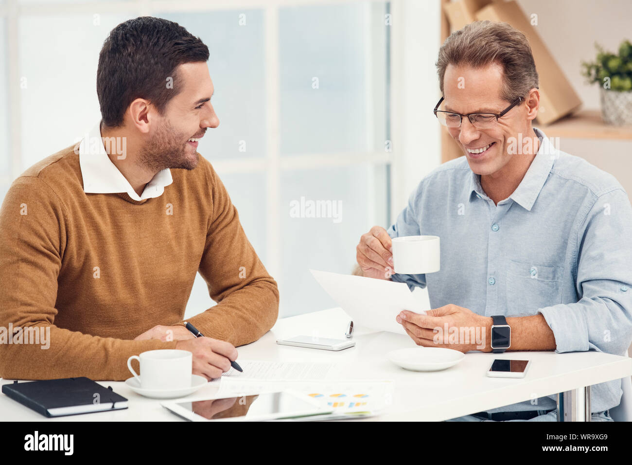Two business men together in the office Stock Photo - Alamy
