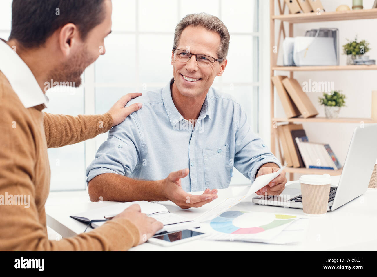 Two business men together in the office Stock Photo - Alamy
