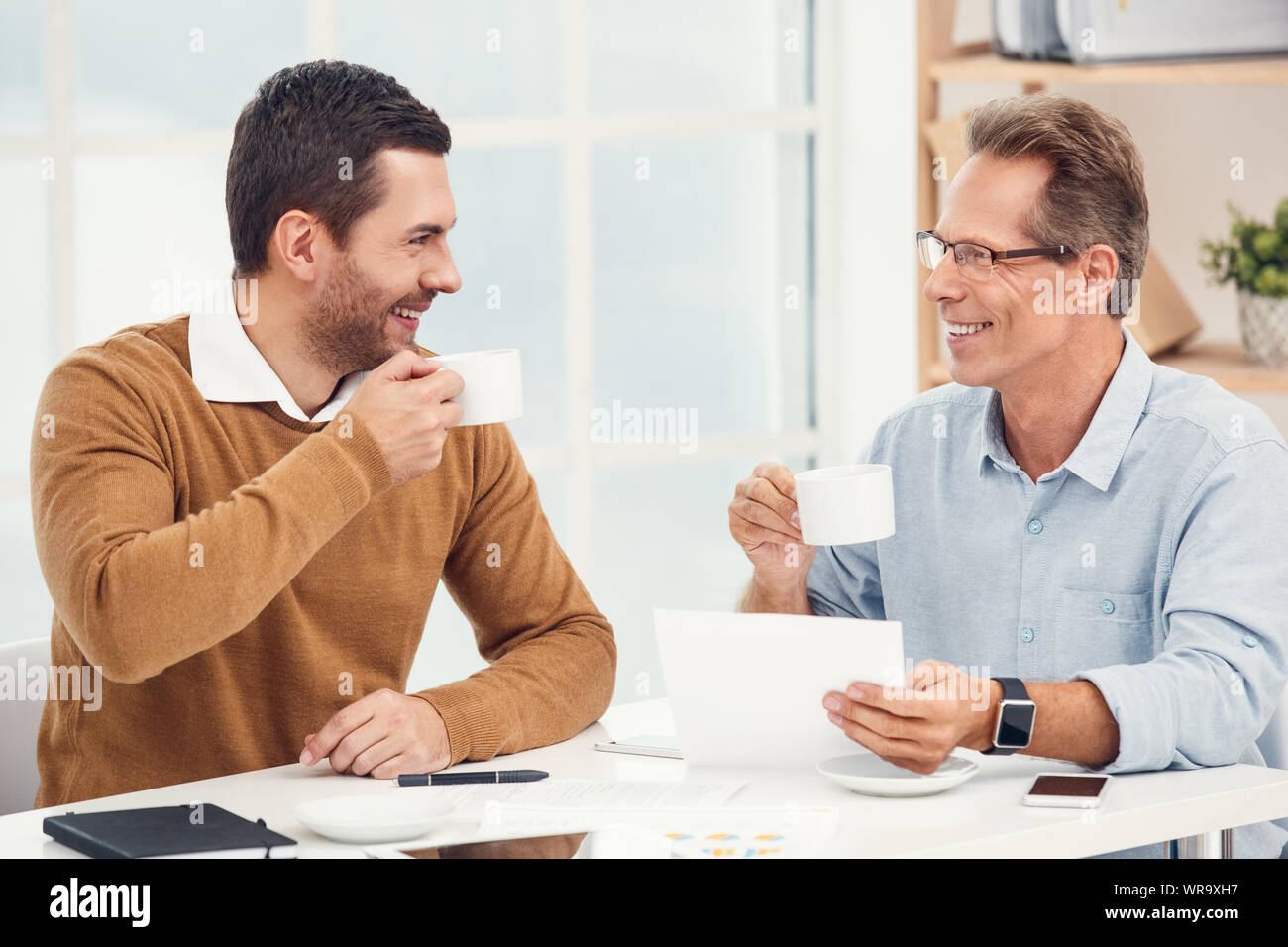 Two business men together in the office Stock Photo - Alamy